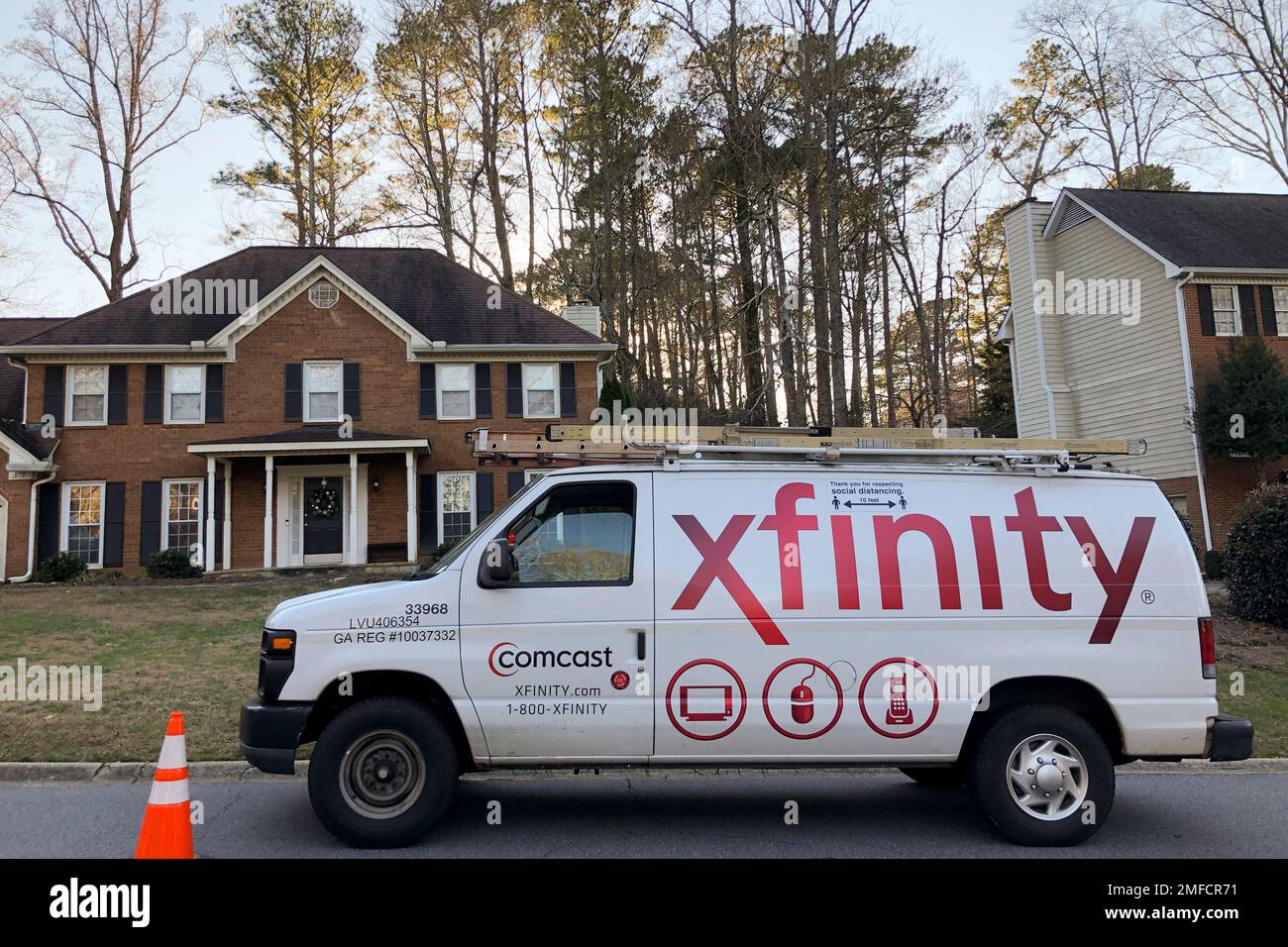 A Comcast van sits in front of a residence on Dec. 26, 2020, in ...
