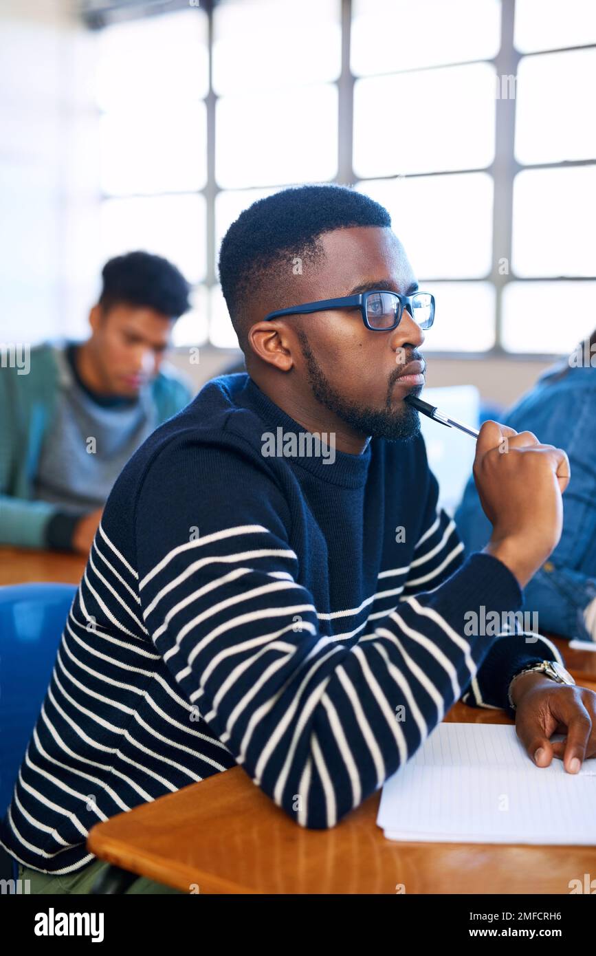 Student sitting table books hi-res stock photography and images - Alamy