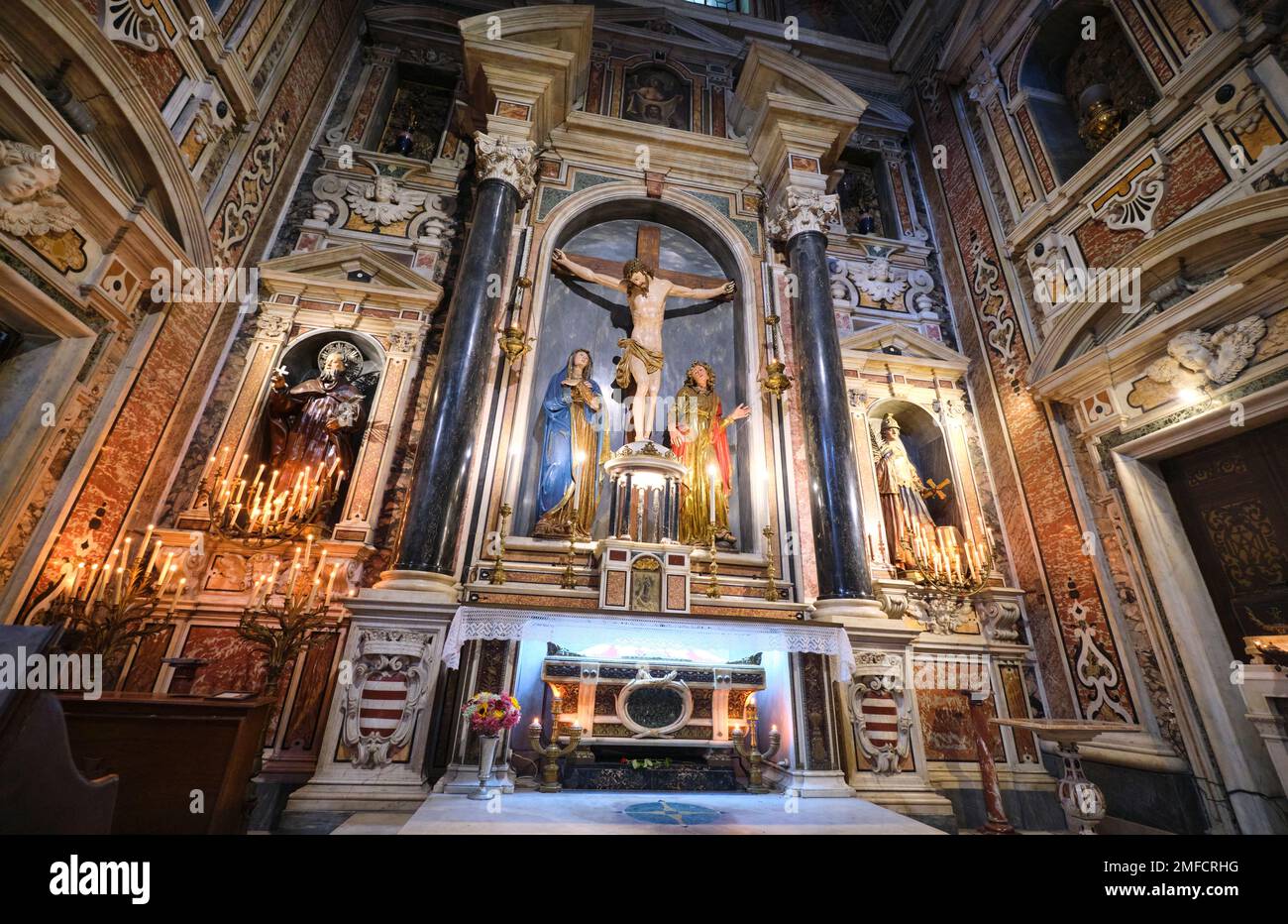 One of the side alcoves with a resurection of Christ sculpture and rich ...