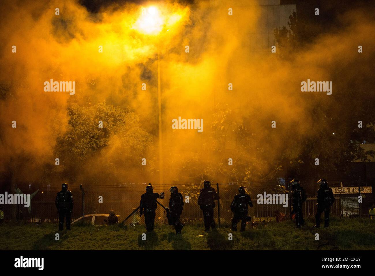 Mobile anti-riot squad ESMAD monitor America de Cali fans as the final ...