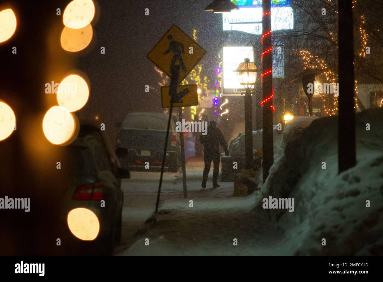 Silhouette in Snow Storm with Christmas Lights - California Stock Photo ...
