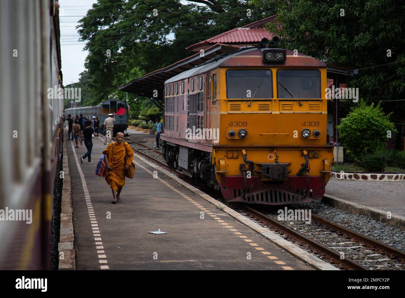Golden Monk and Golden Train - Thailand Stock Photo - Alamy