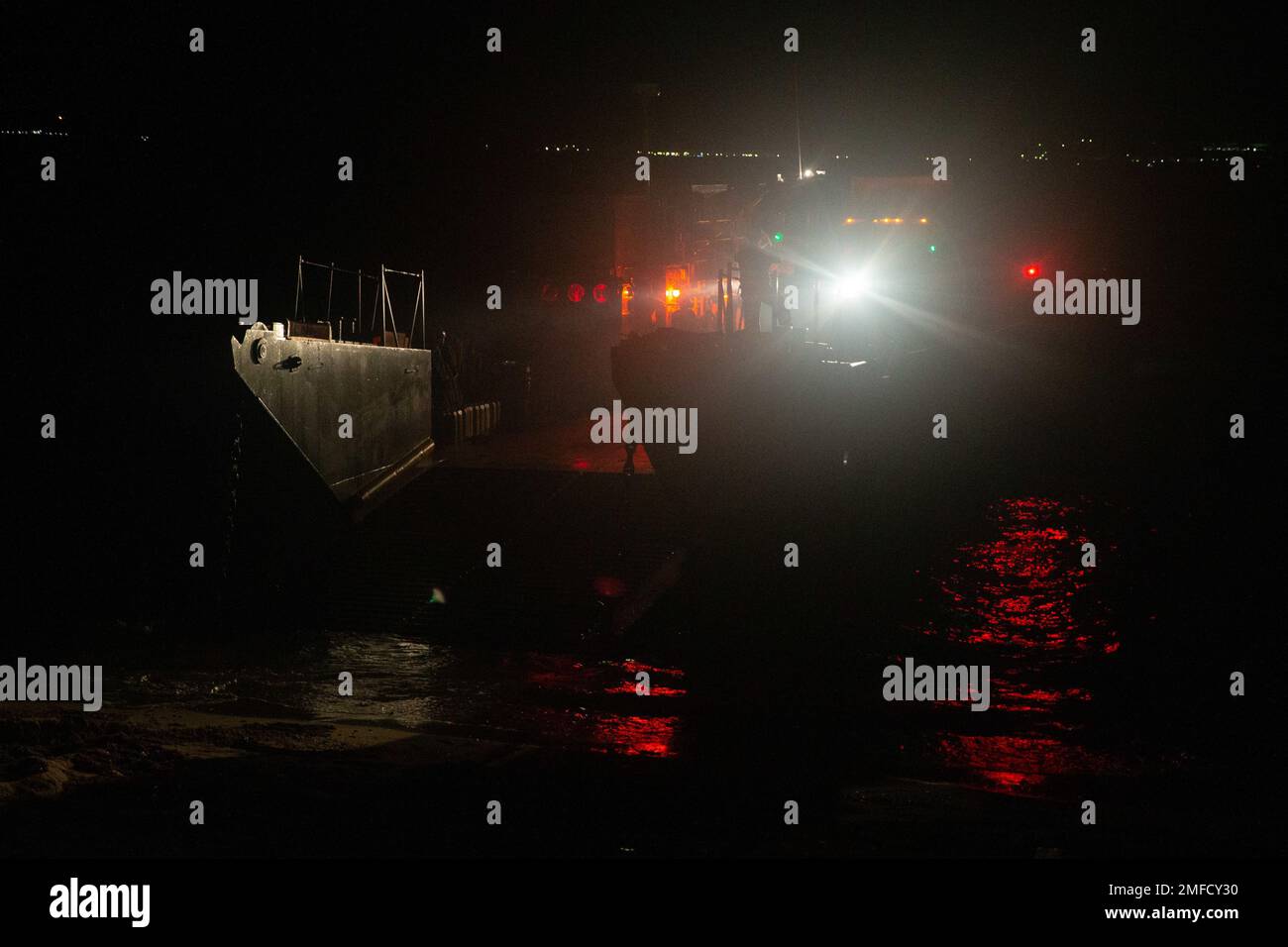 A U.S. Navy Landing Craft, Utility (LCU) with Naval Beach Unit 7 ...