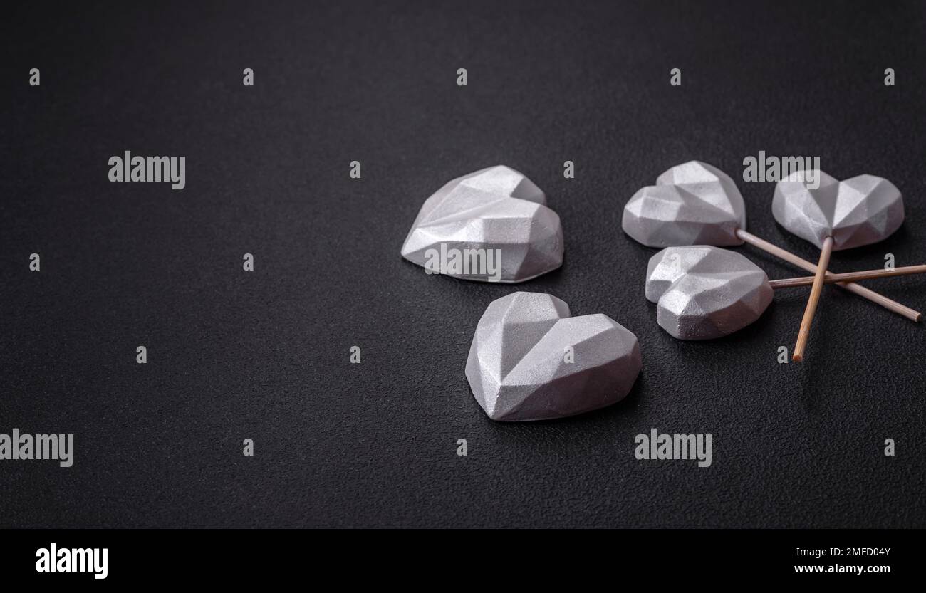 Beautiful tasty sweet candies in gray color on a dark concrete ...