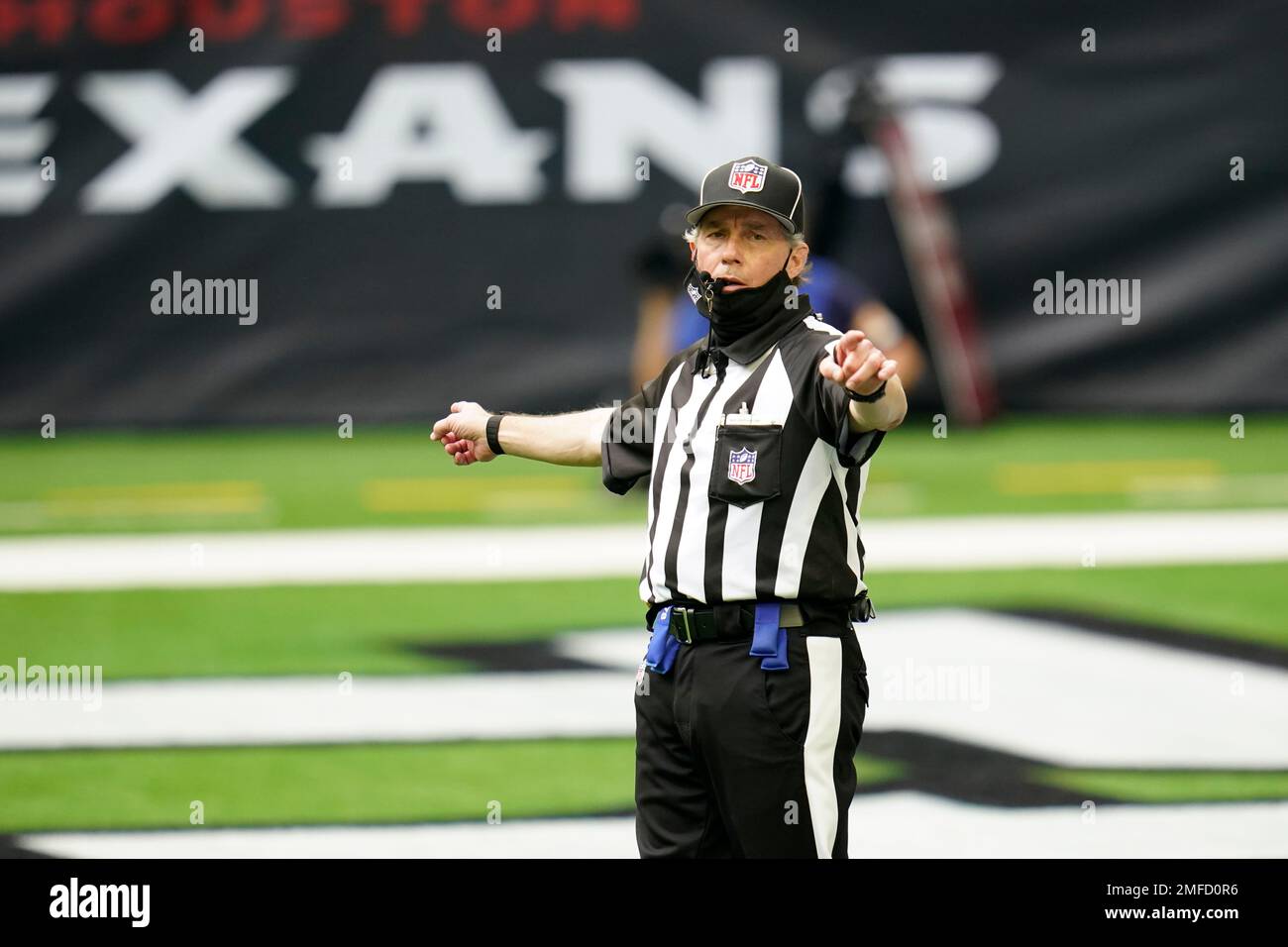 NFL back judge Greg Meyer (78) signals after a play during an NFL ...