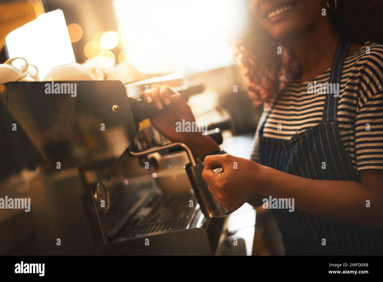 This is how a cup of magic is made. Closeup shot of a barista operating ...