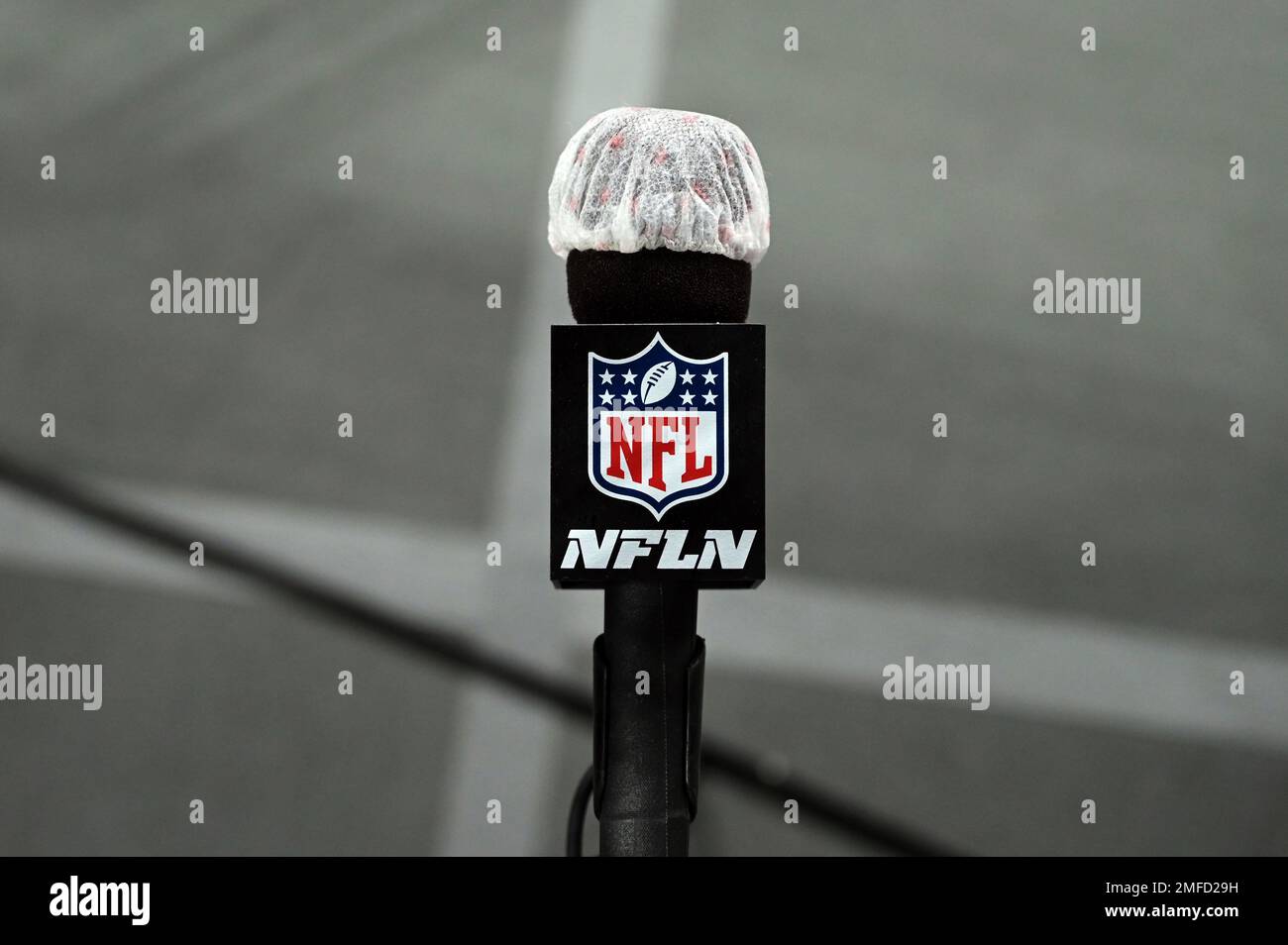 An NFL Network microphone is seen with a protective covering during an ...