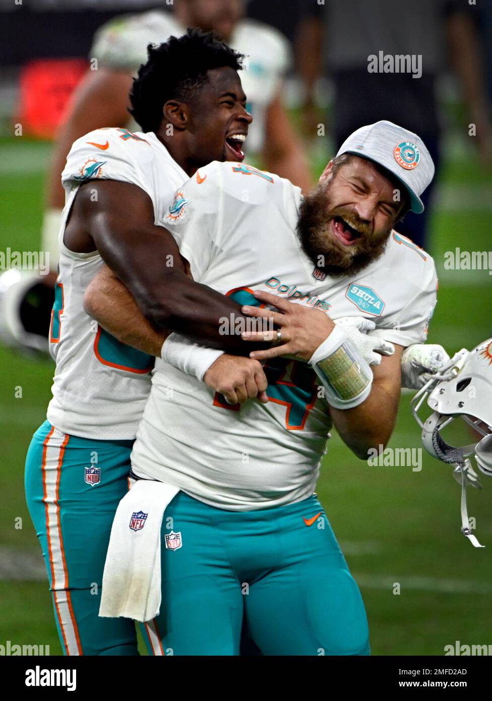 Miami Dolphins wide receiver Isaiah Ford, left, celebrates with ...
