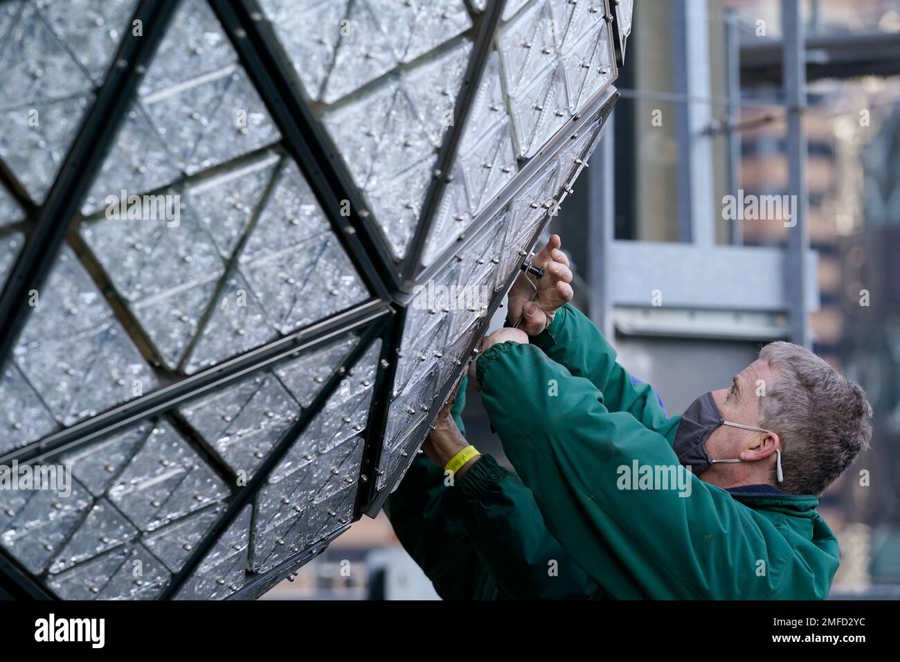 Workers from Landmark Signs install a panel of Waterford crystal ...