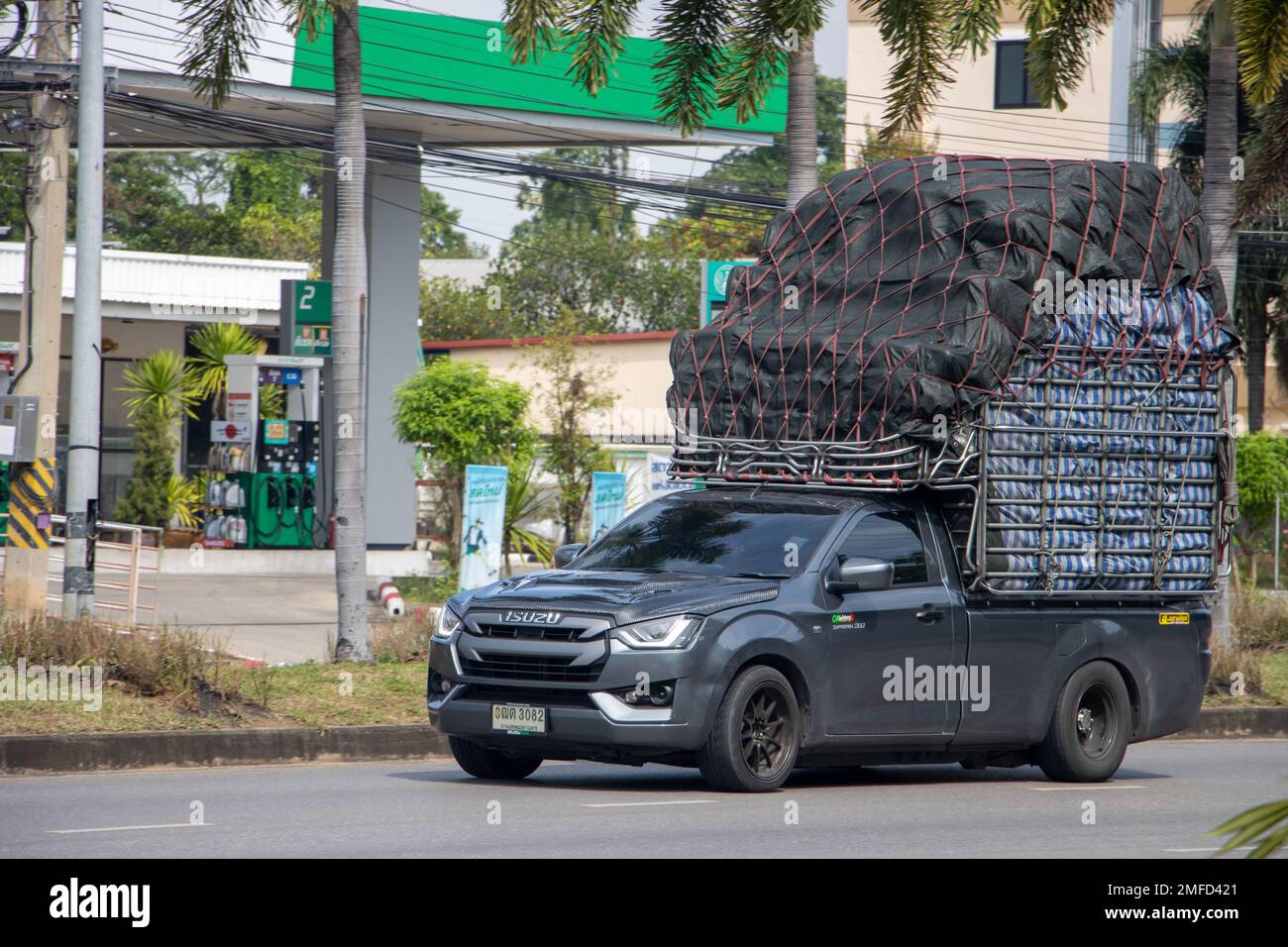 RATCHABURI, THAILAND, NOV 16 2022, A fully loaded pick up is driving ...