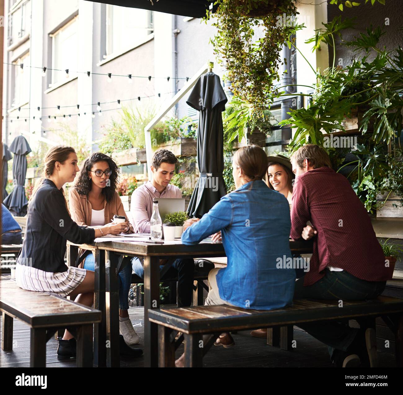 Getting down to business. a group of designers having a meeting at a ...