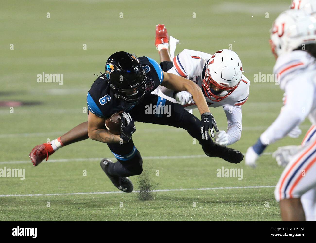 Liberty safety Javon Scruggs (1) tackles Coastal Carolina wide receiver ...