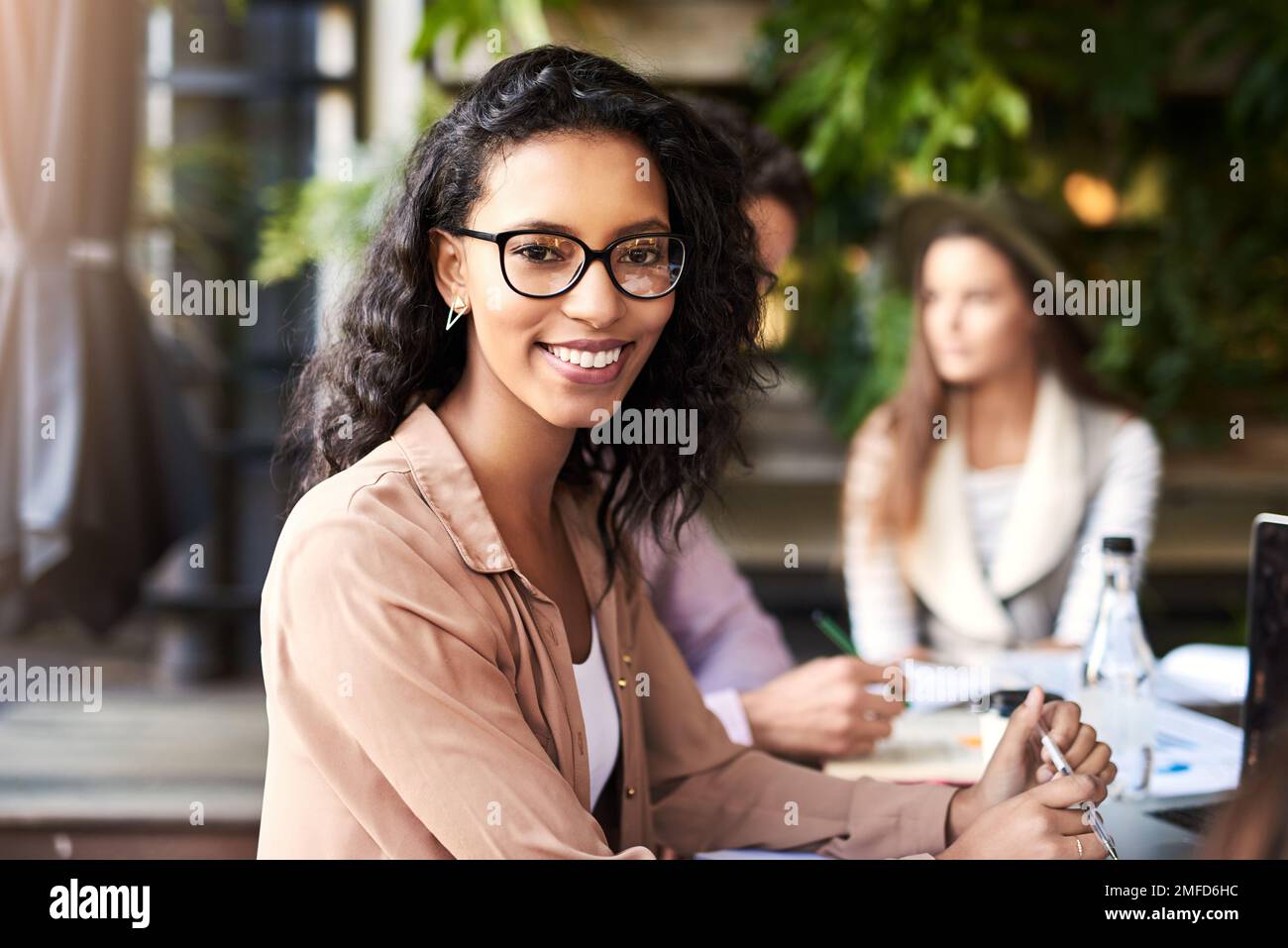 Working in different places keeps us inspired. Portrait of a young ...