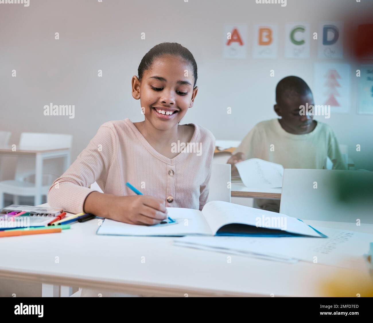 Education, smile and child in classroom learning reading, writing and ...