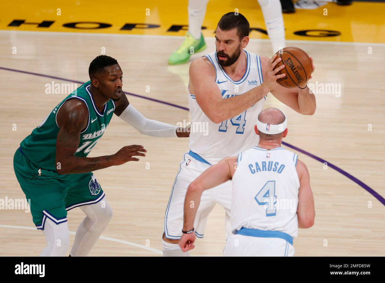 Los Angeles Lakers' Marc Gasol (14) is defended by Dallas Mavericks ...