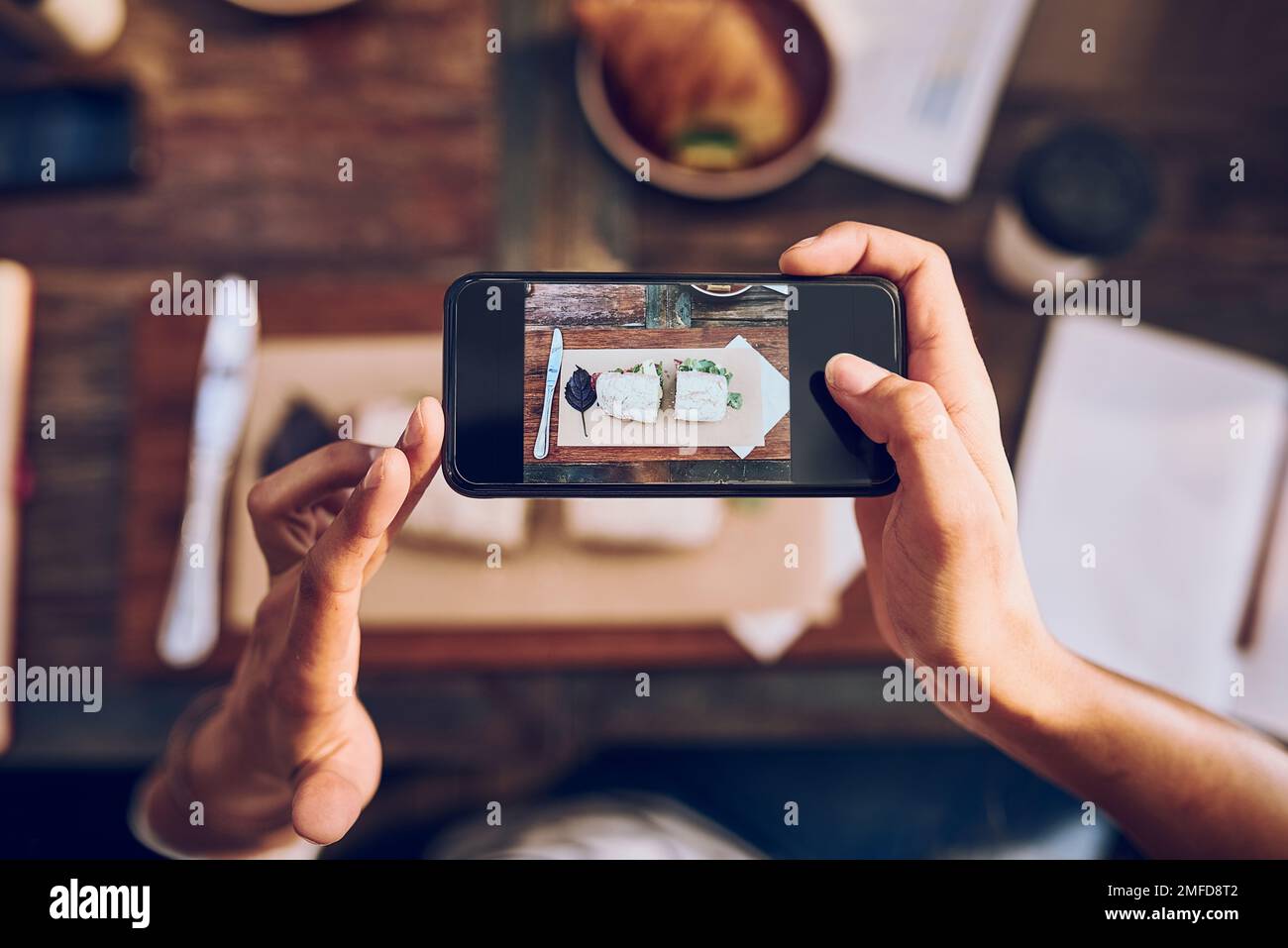 Sharing some lunch inspiration online. a man taking a picture of his ...