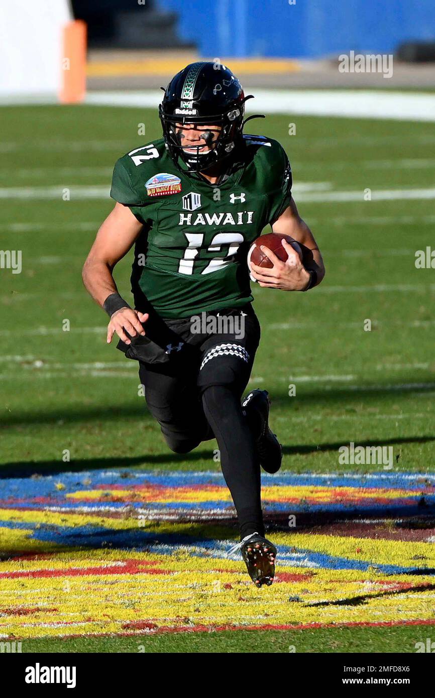 Hawaii quarterback Chevan Cordeiro (12) runs upfield in the second ...