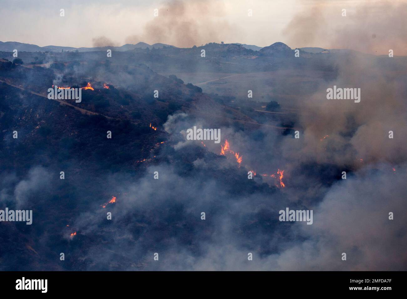 Smoke rises from a wildfire in Fallbrook, northern San Diego County ...