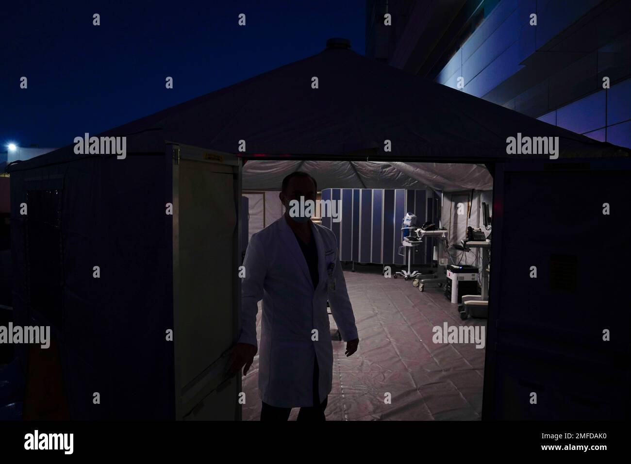 Dr. Jim Keany, an emergency medicine specialist, shows a triage tent ...