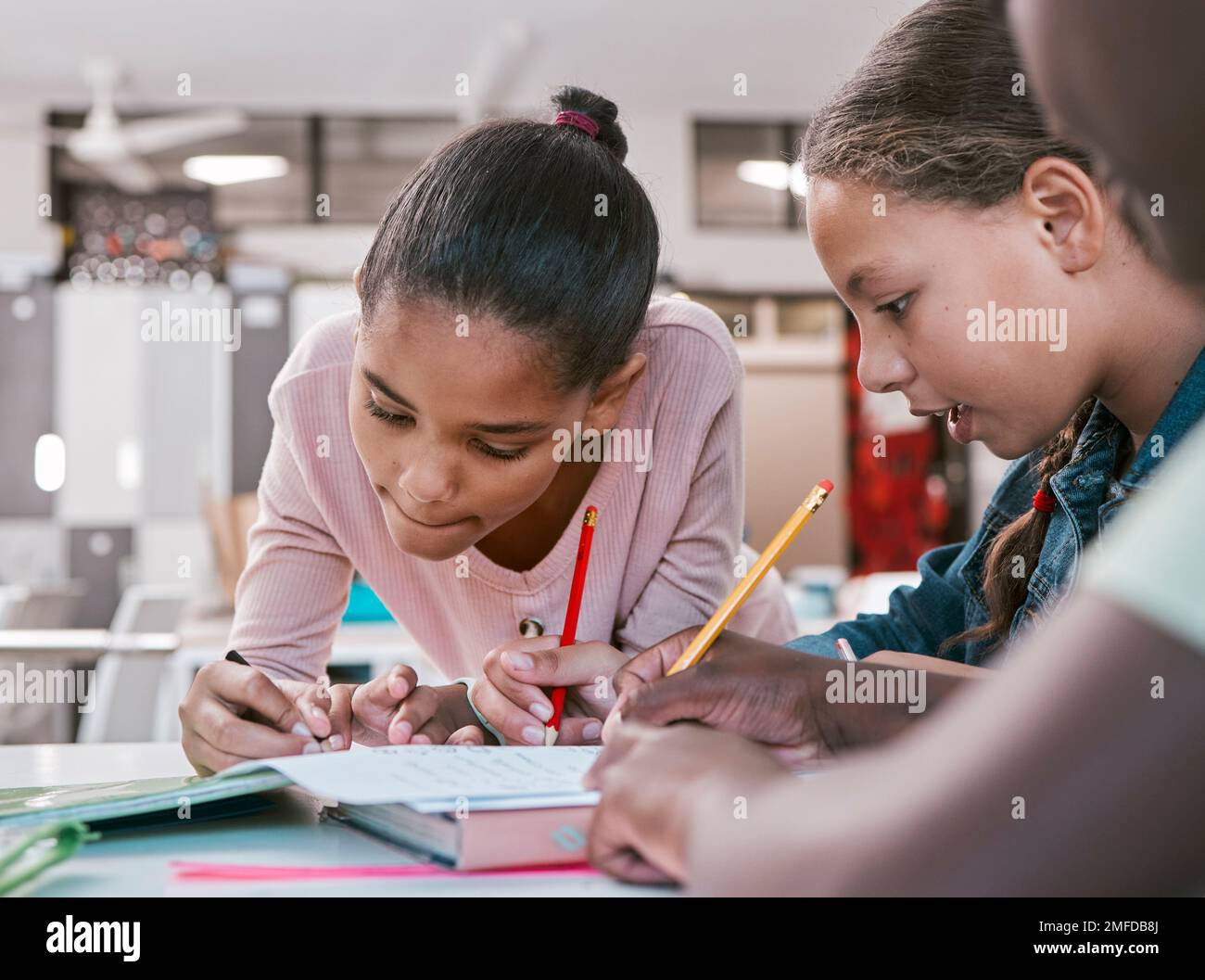 Kids, students and group writing in classroom for learning activity and ...