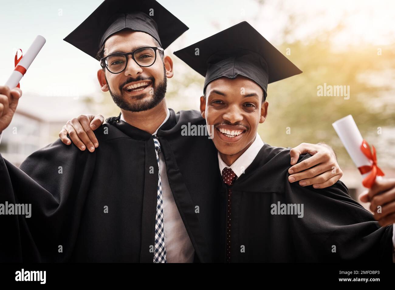 Education is the key to success. Portrait of male students on ...
