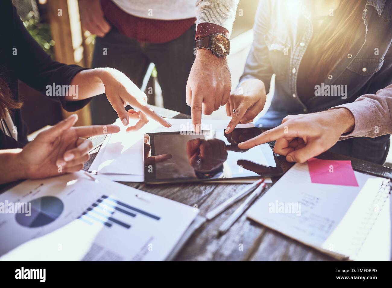 Digitizing data discussions. a team of colleagues using a digital ...