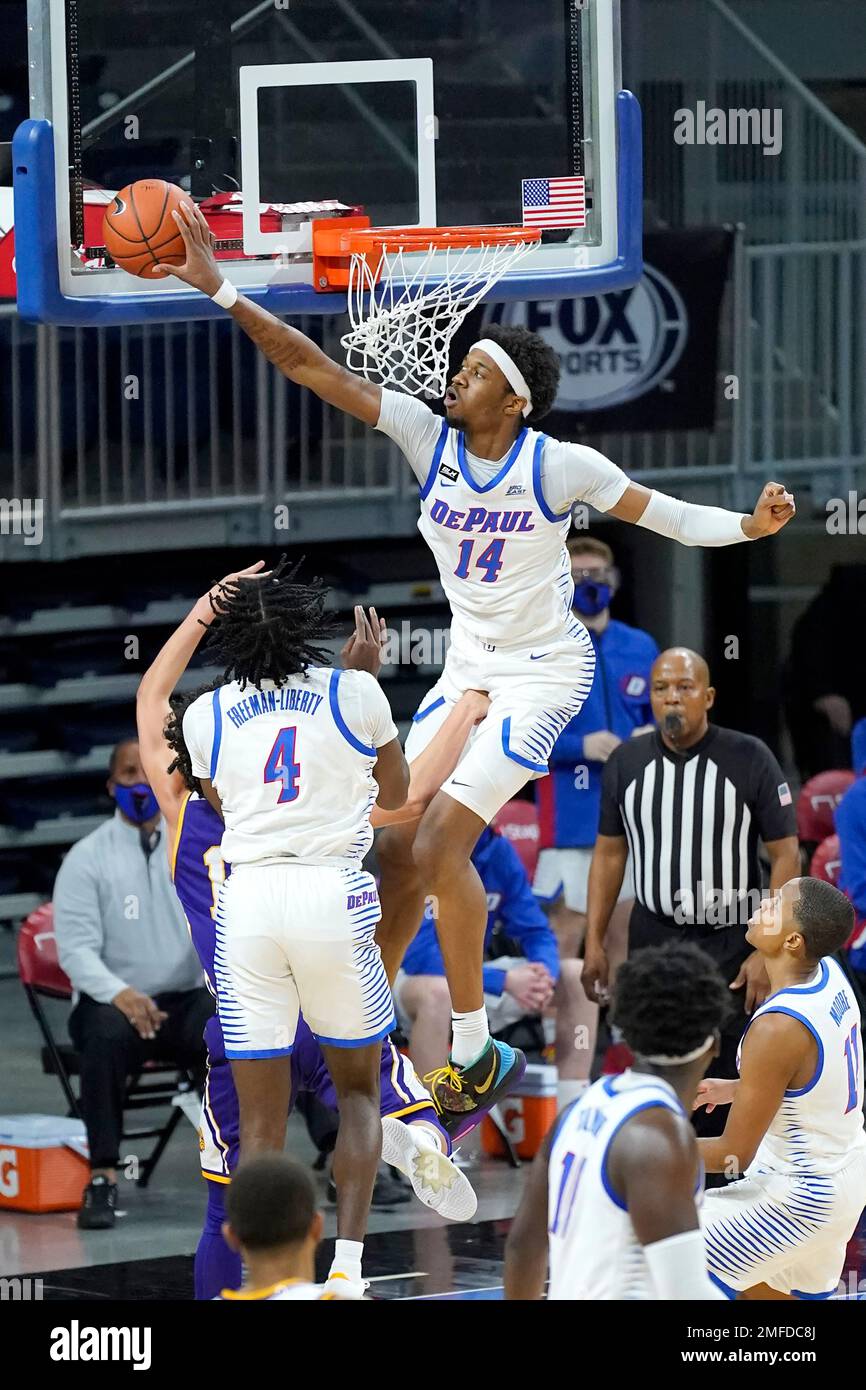 DePaul's Nick Ongenda (14) blocks the shot of Western Illinois' JJ ...