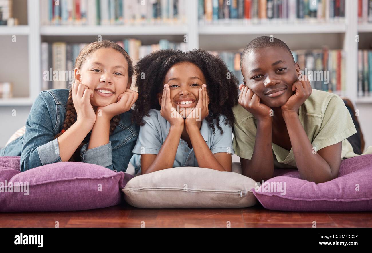 Children in library, portrait with learning and education, happy with ...