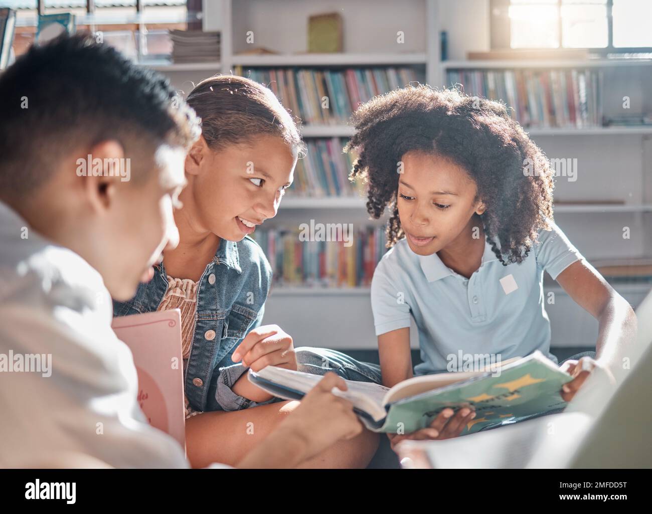 Education, storytelling or students reading in a library for group ...