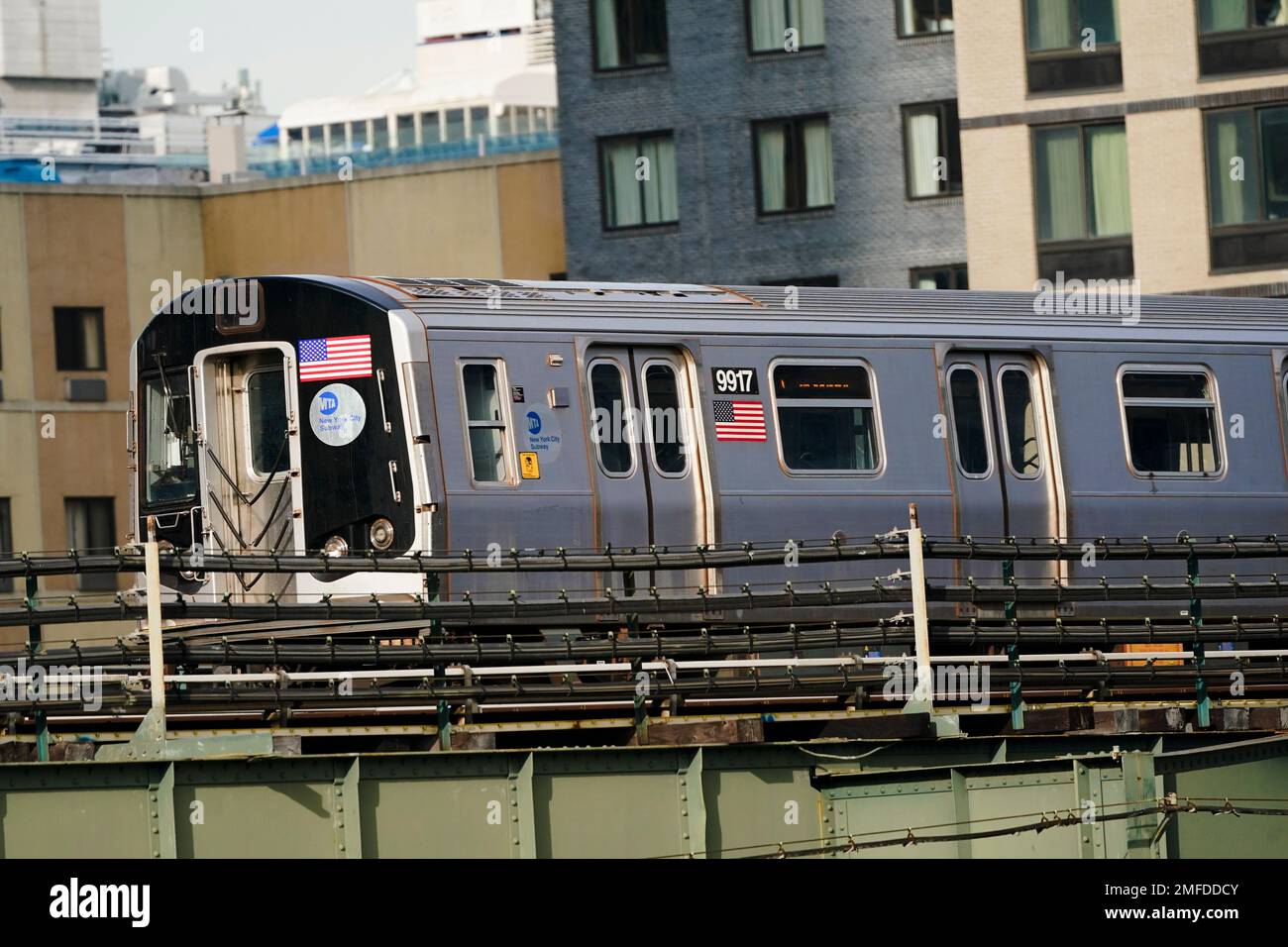An N train moves through the Long Island City neighborhood Wednesday ...