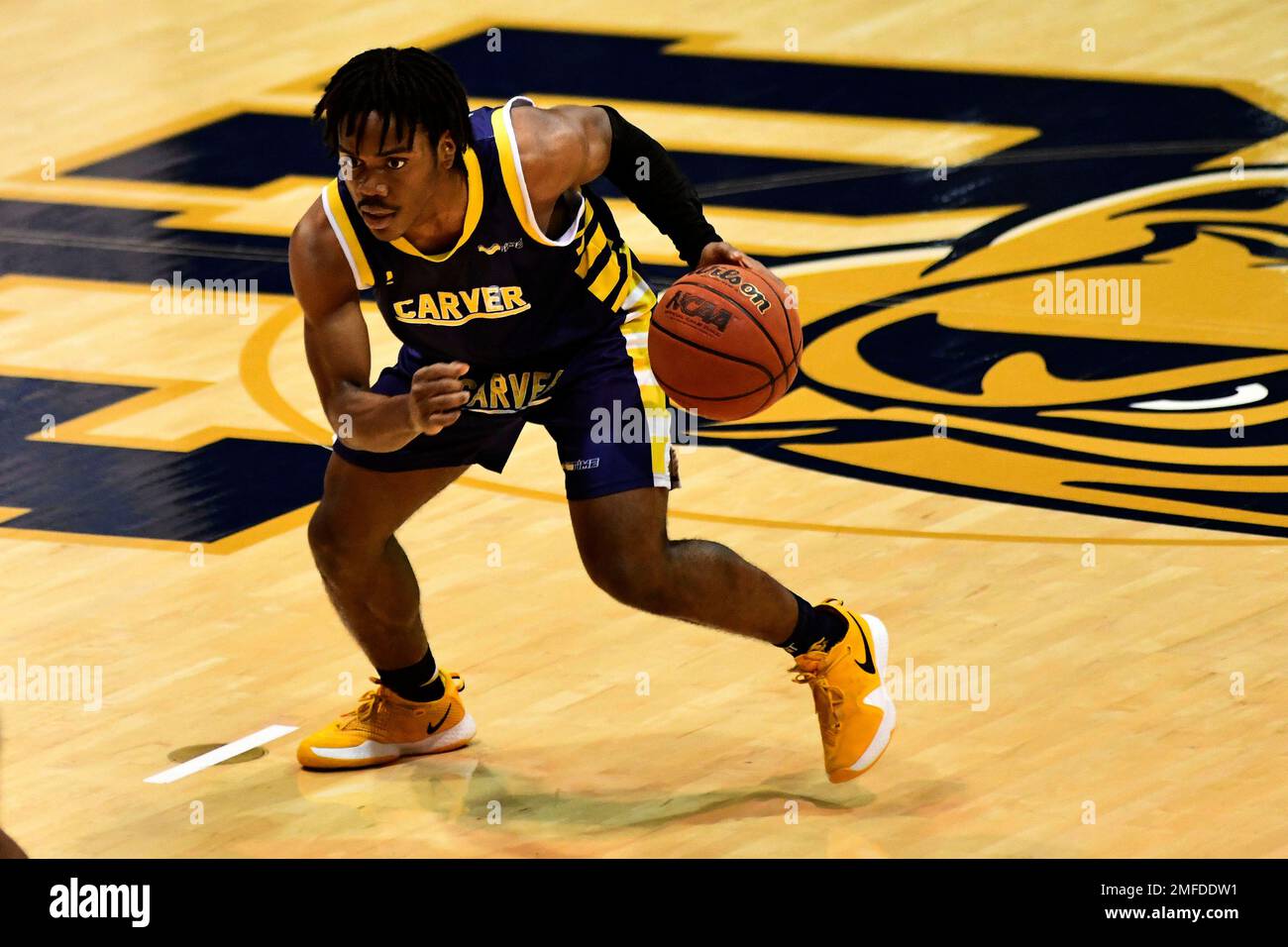 Carver College guard Chris Iverson brings the ball down court during ...