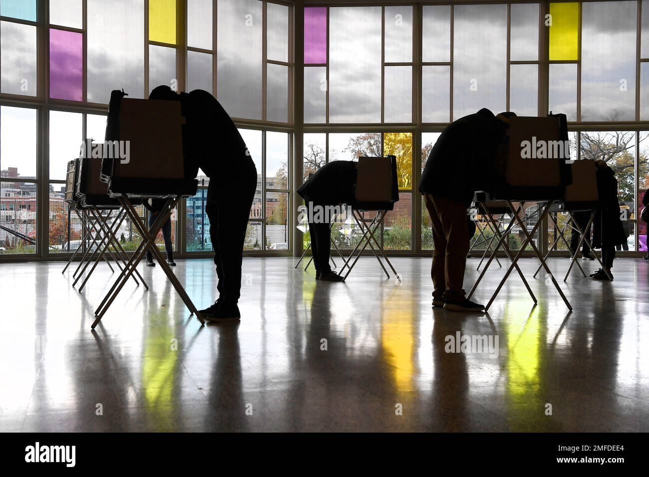 Voters mark their ballots at First Presbyterian Church in Stamford ...