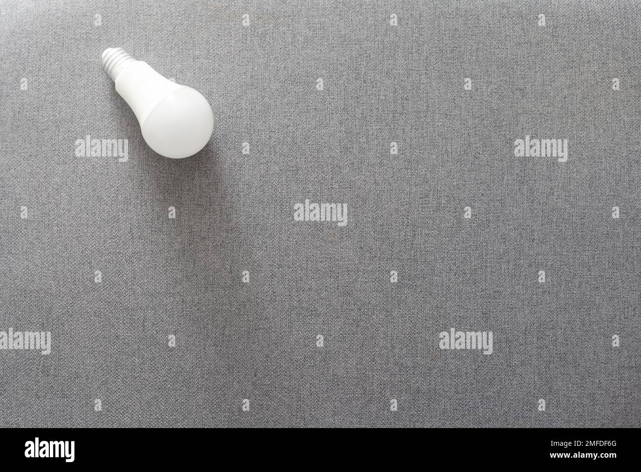 LED light bulb on blue gray background Stock Photo - Alamy