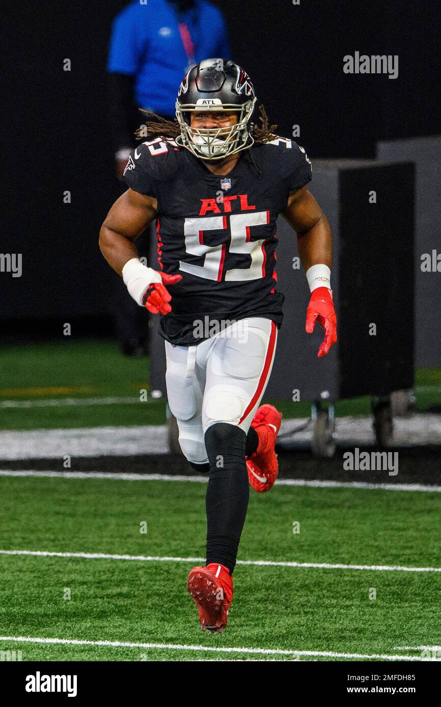 Atlanta Falcons defensive end Steven Means (55) runs out of the tunnel ...