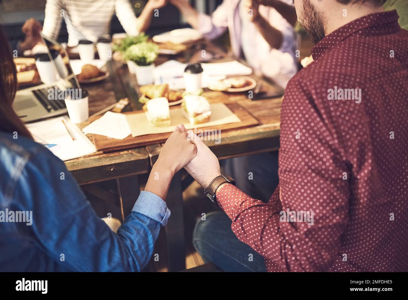 Prayer is a good way to start a meeting. unrecognizable creative ...