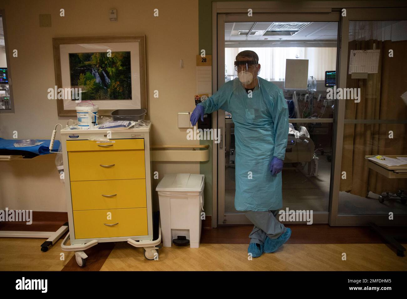 Nurse Spencer Cushing, 29, pauses briefly after tending to a COVID-19 ...