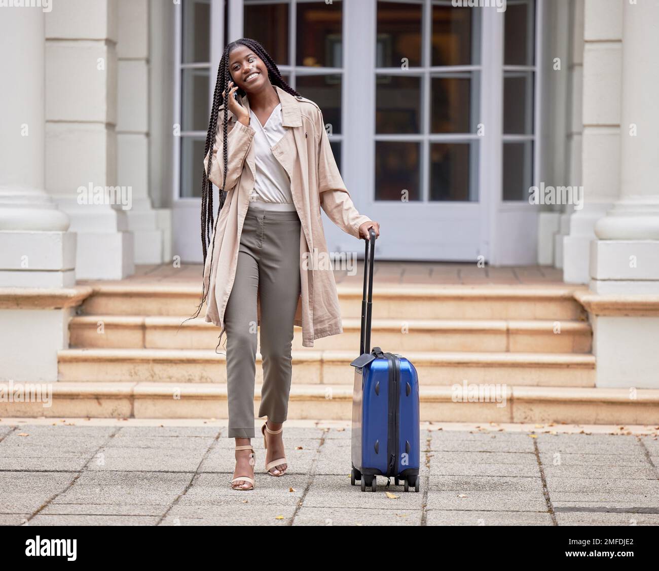 Travel, business phone call and black woman with suitcase in city for ...
