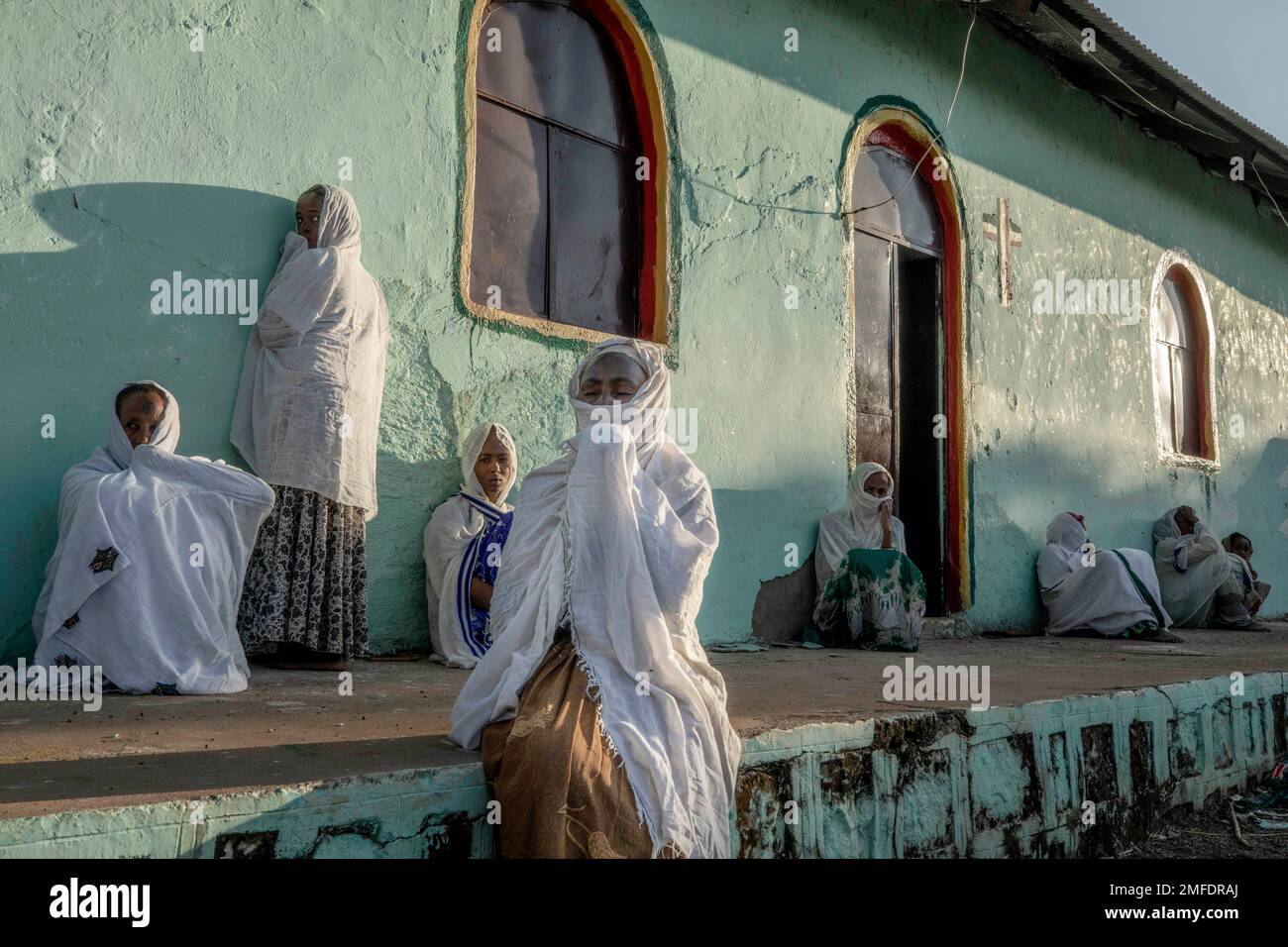 Women who fled the conflict in Ethiopia's Tigray region pray during ...