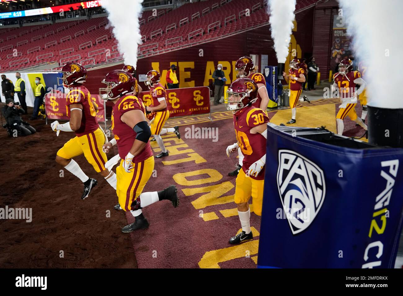Southern California football players enter the stadium before an NCAA ...