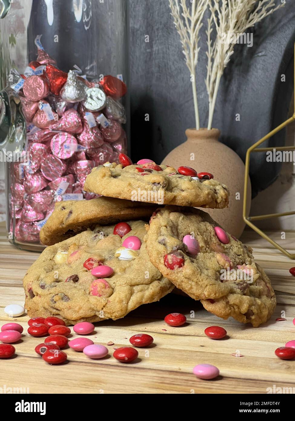 A vertical closeup of cookies with colorful candies in the kitchen ...
