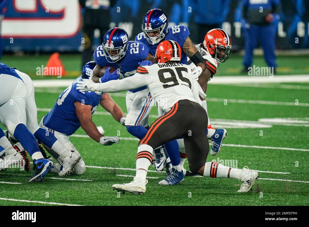 New York Giants' Wayne Gallman (22) rushes past Cleveland Browns' Myles ...