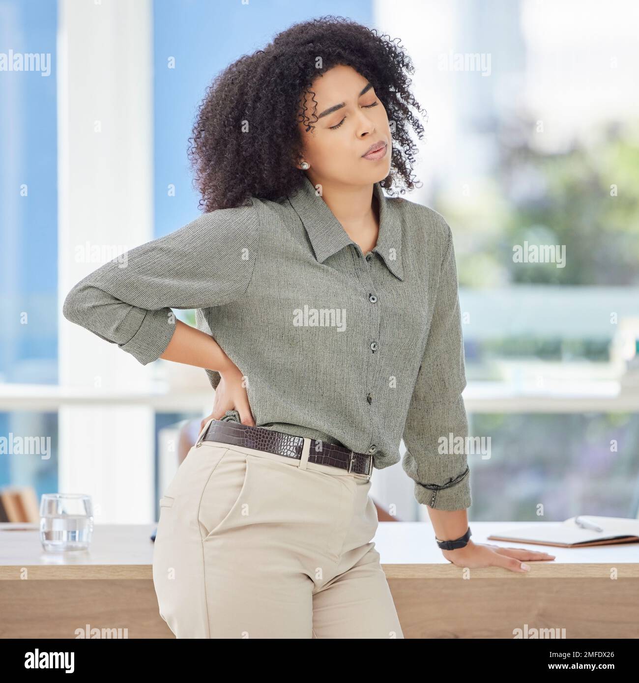 Business, back pain and black woman with stress, burnout and fatigue in ...