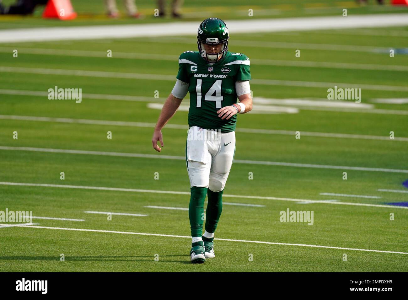 New York Jets quarterback Sam Darnold (14) walks on the field against ...