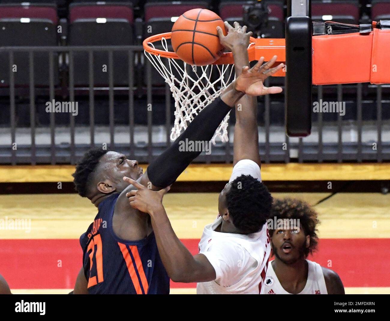 Rutgers guard Montez Mathis, front right, attempts to dunk the ball as ...