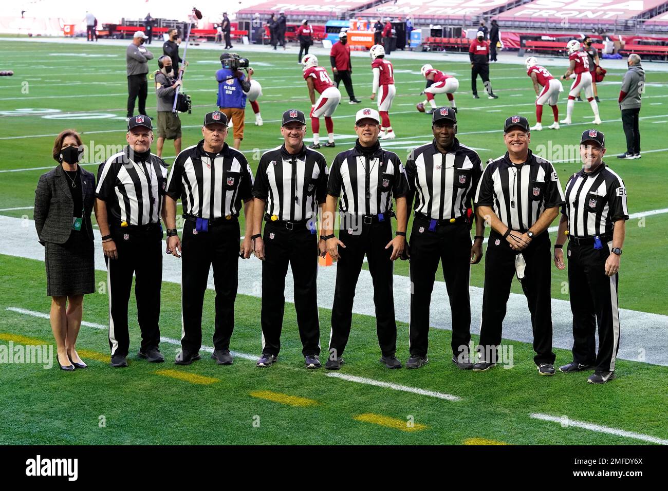 From right; field judge Aaron Santi, head linesman Jerry Bergman ...
