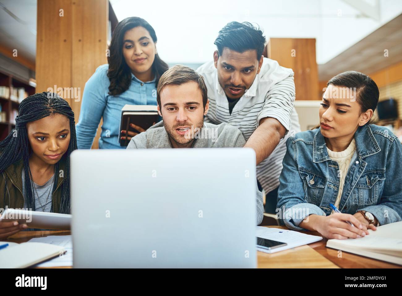 Its easier in a study group. a group of university students studying in ...