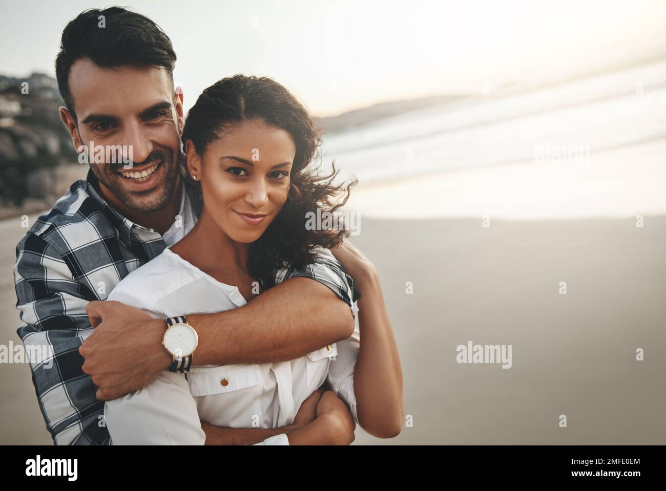 Well choose each other every time. a young man hugging his girlfriend ...