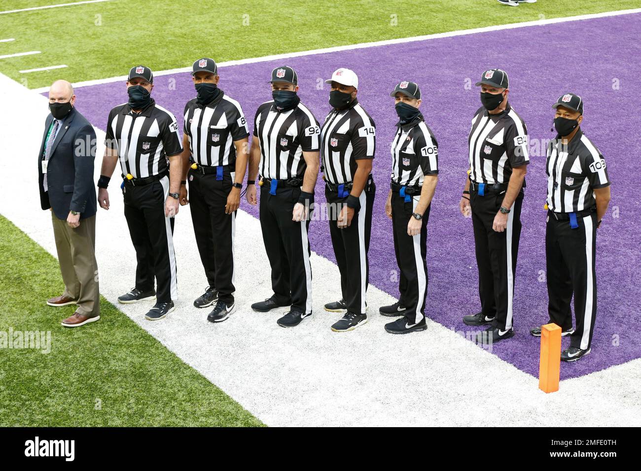 Officials, from left to right, replay official Kevin Brown, down judge ...