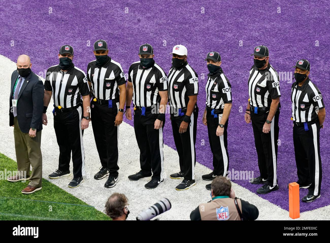 Officials, from left to right, replay official Kevin Brown, down judge ...