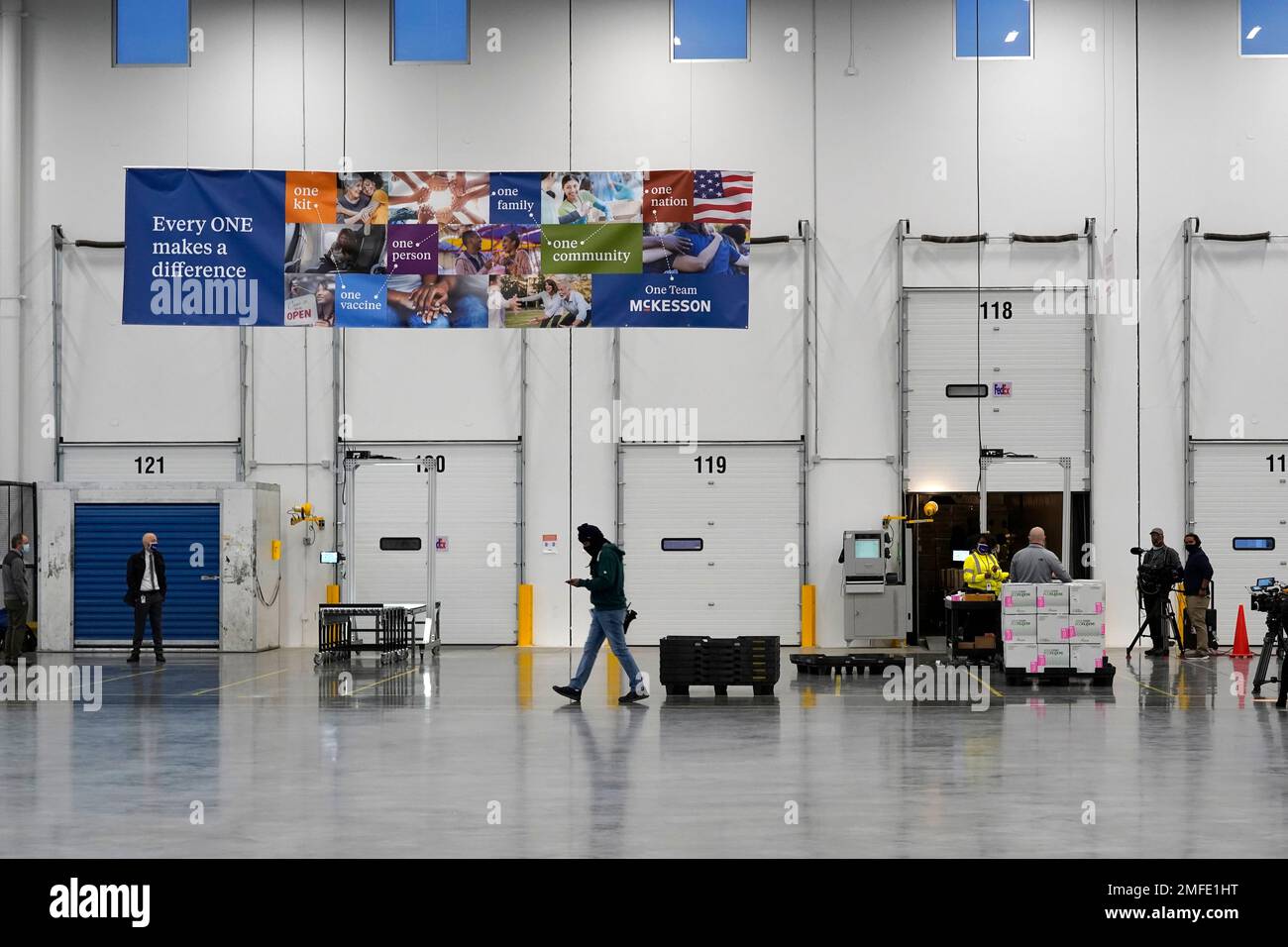 Boxes containing the Moderna COVID-19 vaccine are moved to the loading ...